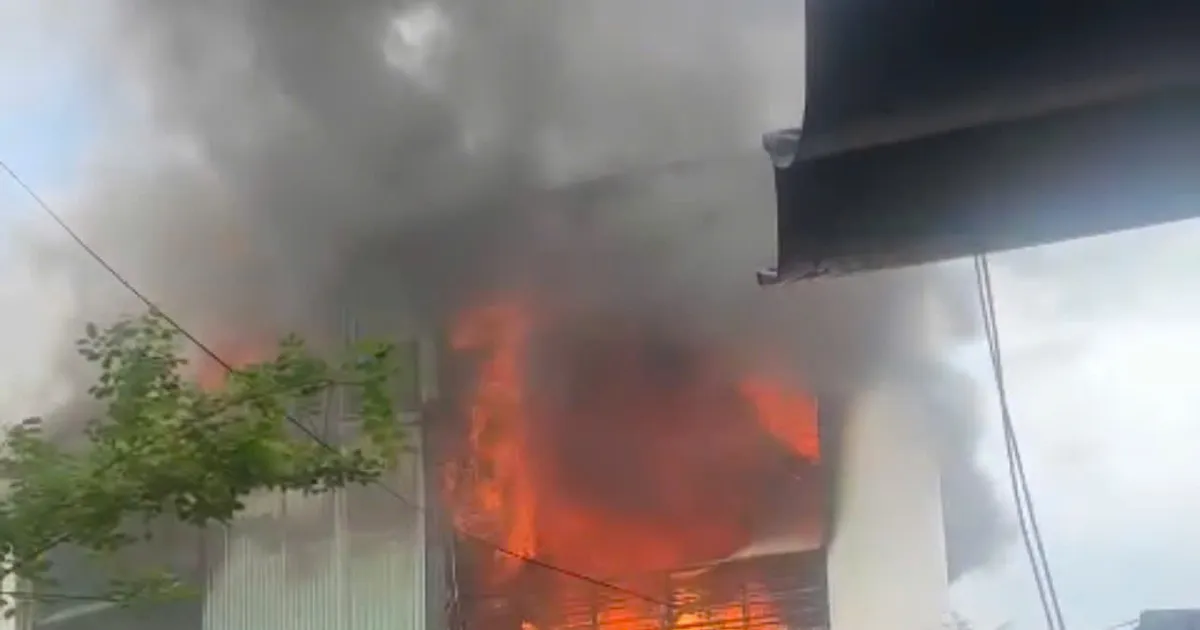Firefighters are working to control a fire in a high-rise building in a ...