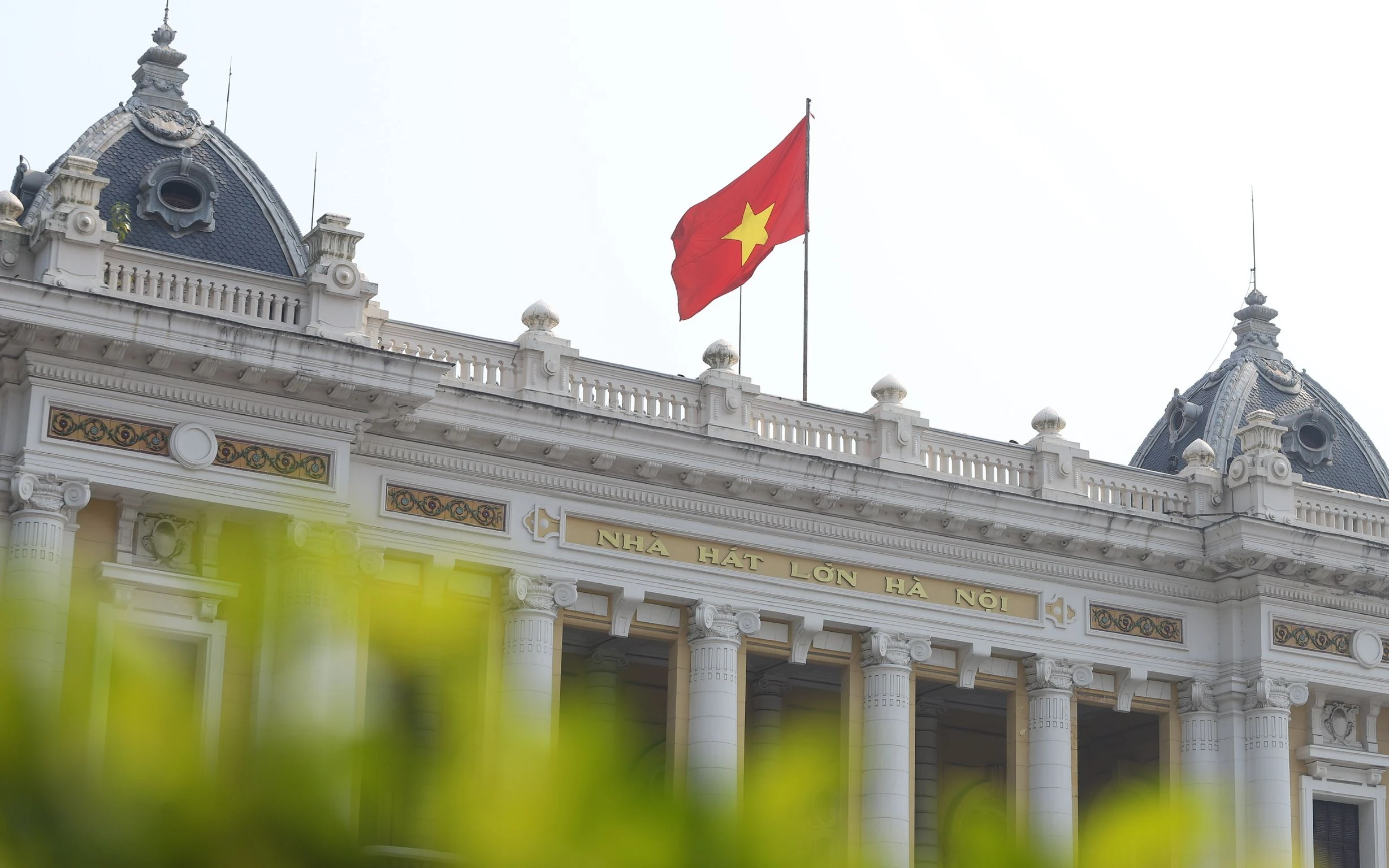 Hanoi is ablaze with the red of the Party flag and the national flag to ...