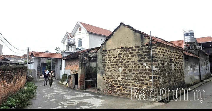 A century-old laterite stone village amidst ancient lands.