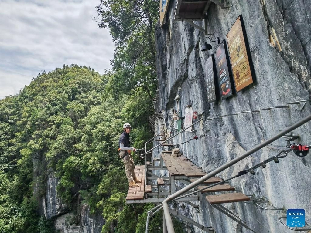 A unique coffee experience: 'hanging' on a cliff in Southwest China.