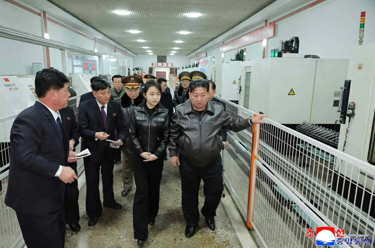 North Korean leader Kim Jong Un and his daughter visit a gun ...