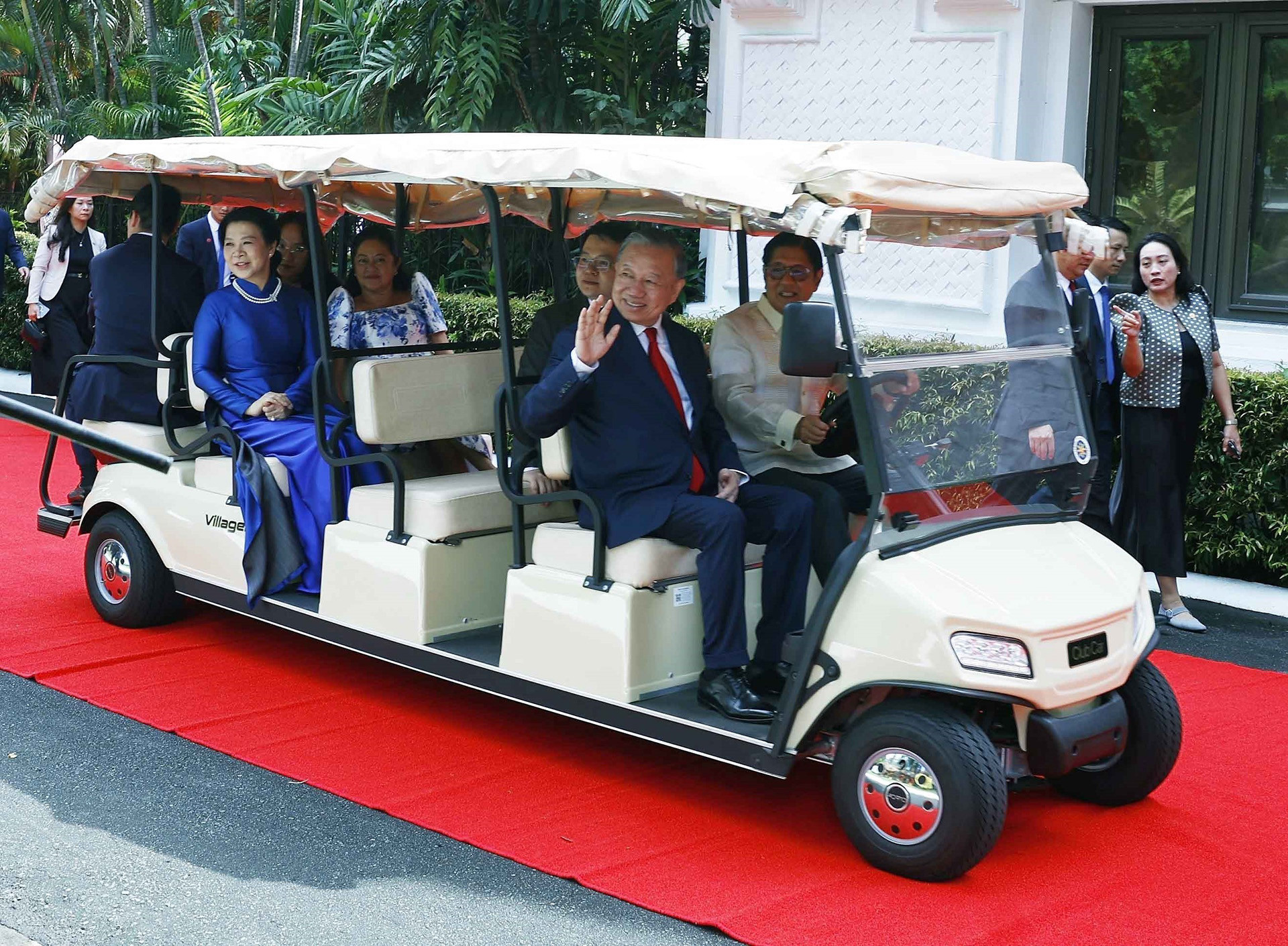 Philippine President Marcos Jr. drove an electric vehicle carrying ...