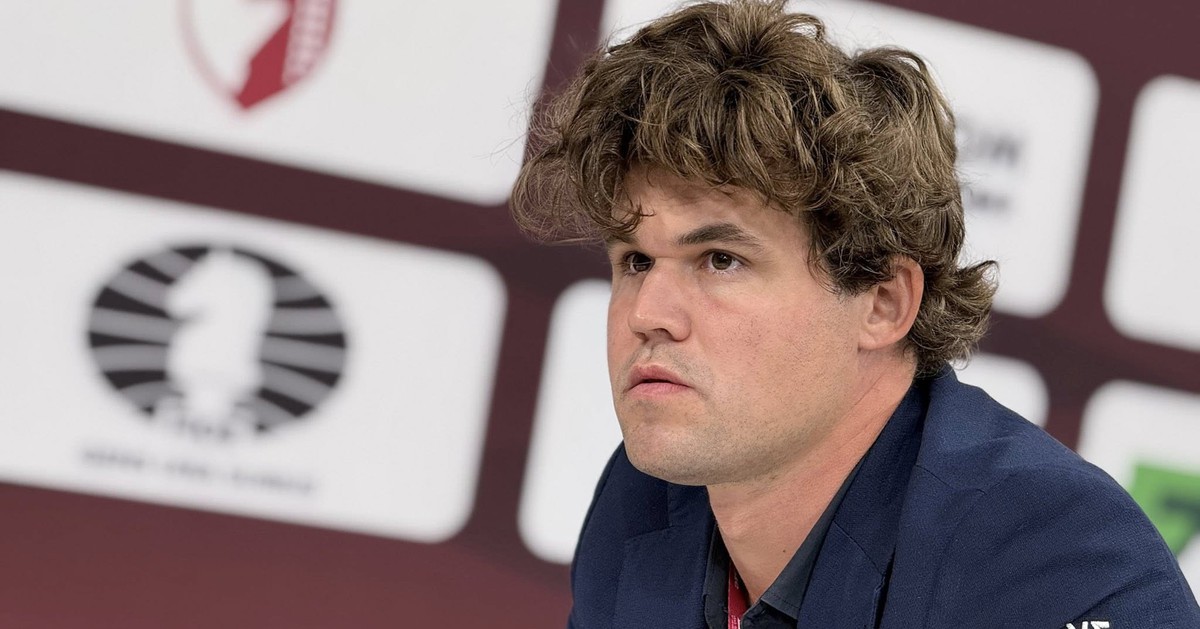 Carlsen lost his temper and knocked a reporter's camera away after ...